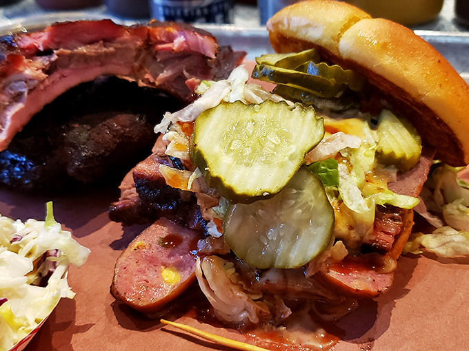 Not so much a sandwich as a carefully constructed monument to excess. The pickles aren't garnish—they're essential acid counterpoints to the meat symphony.