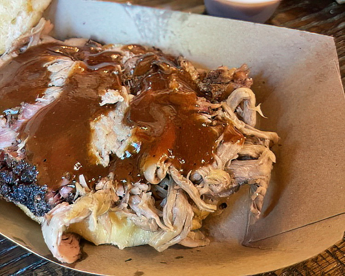 Pulled pork swimming in house-made sauce &ndash; tender strands of smoky goodness that make you wonder why you ever bothered with other food groups.