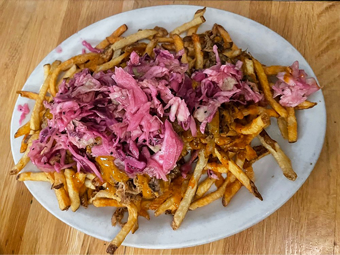 These aren't your average fries &ndash; they're a canvas for pulled pork and vibrant slaw, creating a handheld flavor festival that demands to be shared.