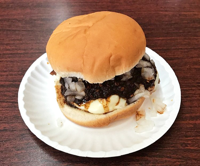 Behold the classic burger in its natural habitat &ndash; simple, honest, and ready to remind you why sometimes the basics are all you need.