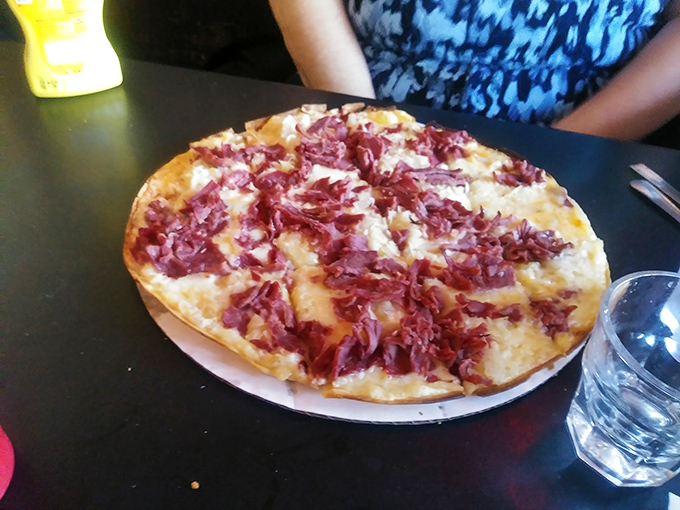 This isn't just pizza&mdash;it's a Reuben in disguise, wearing a cheesy disguise and flaunting its corned beef credentials with shameless abandon.