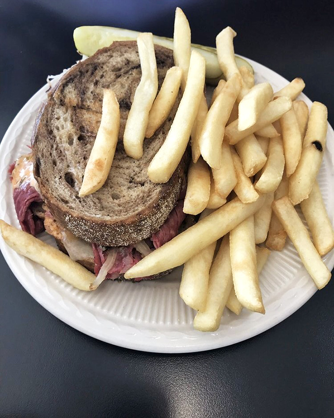 A proper Reuben demands respect and this one commands it. Marbled rye, generous corned beef, and fries that could start their own fan club.
