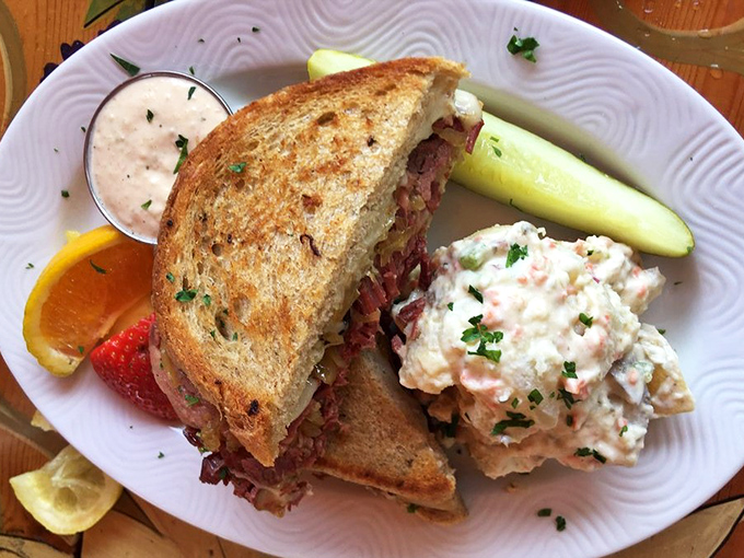 This isn't just a sandwich; it's architecture. Layers of corned beef and sauerkraut with house-made dressing and that potato salad side? Pure Cleveland poetry.