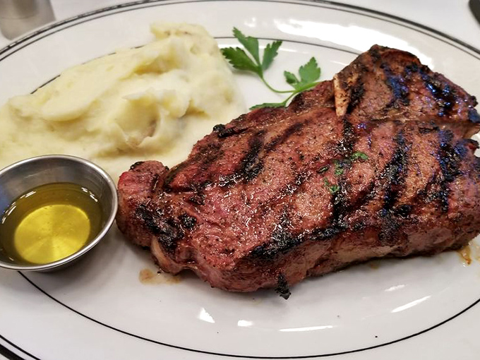 Behold the ribeye in its natural habitat&mdash;perfectly charred exterior, blushing interior, and a side of potatoes that aren't trying to reinvent the wheel, just perfect it.