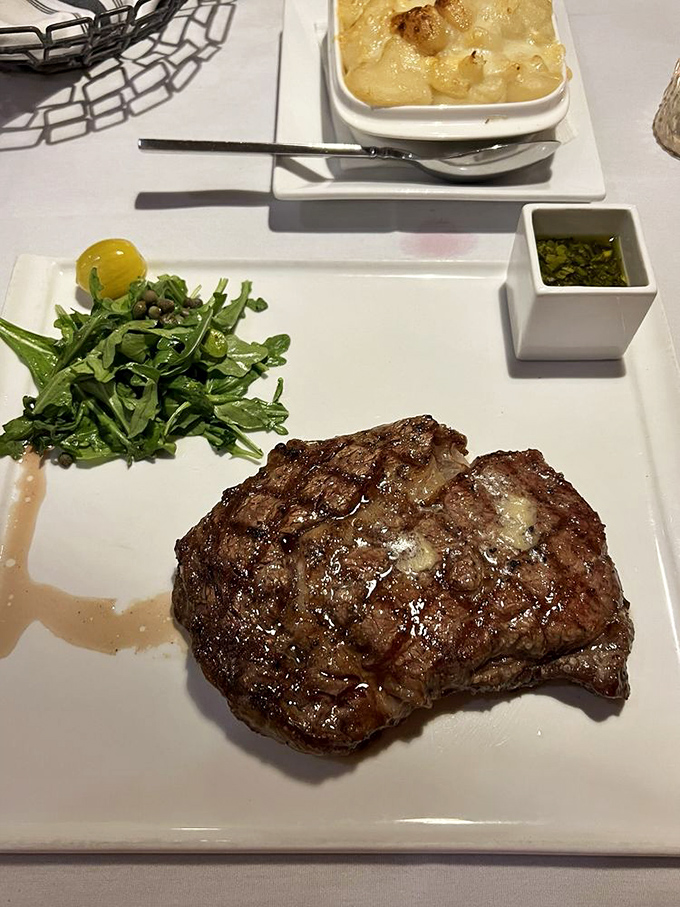 Behold the star of the show: a ribeye with a sear so perfect it deserves its own standing ovation.
