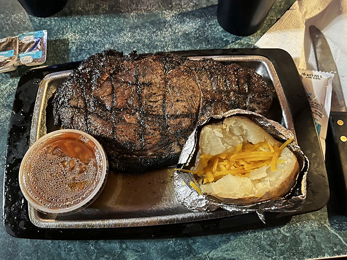 When your steak arrives with a baked potato wearing a tinfoil tuxedo, you know you're in for a meal that's both unpretentious and magnificent.
