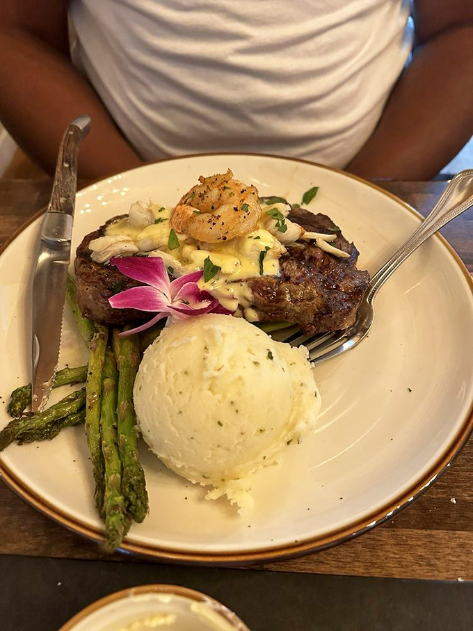 Steak surf-and-turf that would make even the most jaded New Yorker pause mid-sentence. That orchid knows it's in good company..