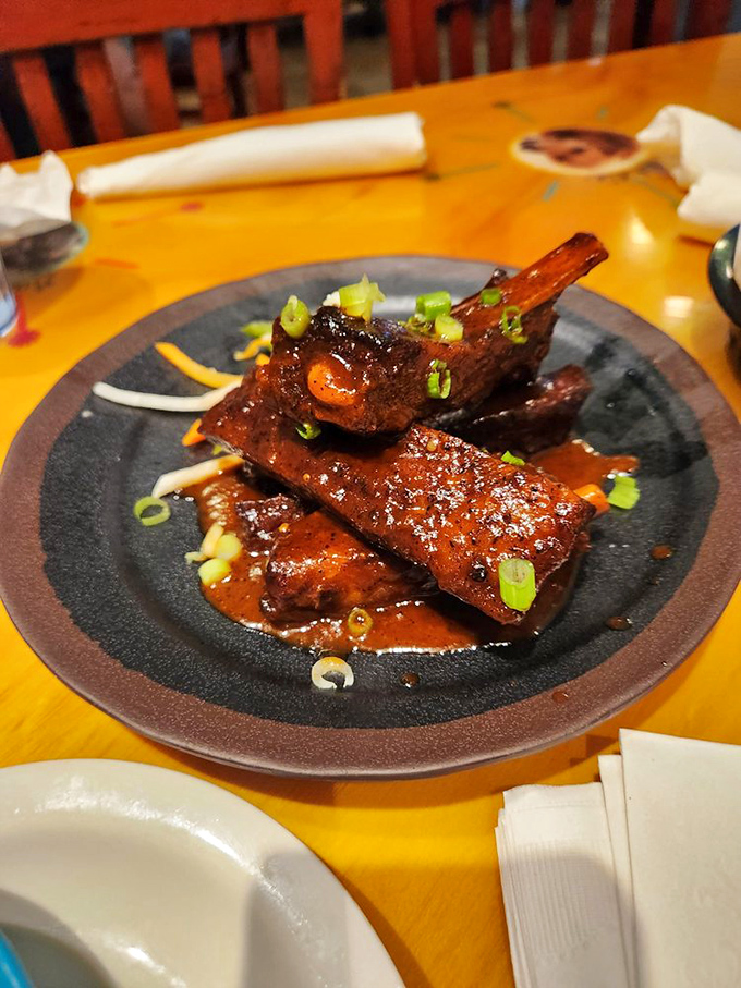 Ribs so tender they practically leap off the bone, glistening with a sauce that should be bottled and sold as Texas perfume.