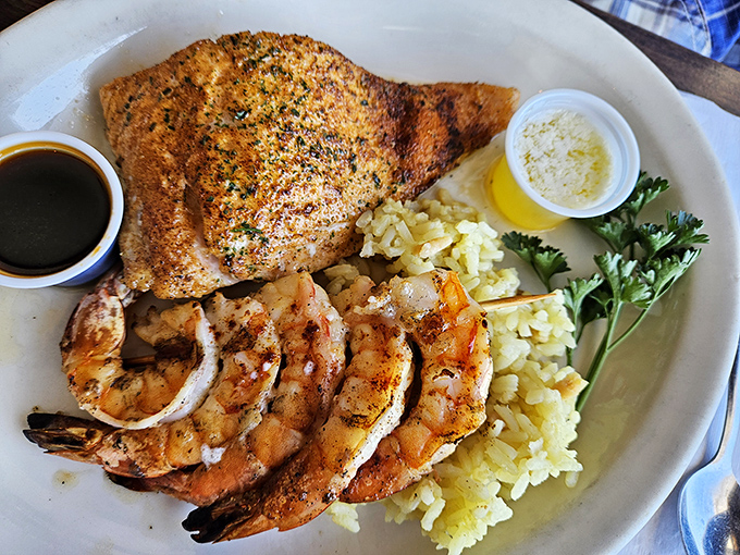 Ocean meets plate in this perfectly executed land-and-sea combo. The salmon and shrimp look like they jumped straight from water to fire to your eager fork.