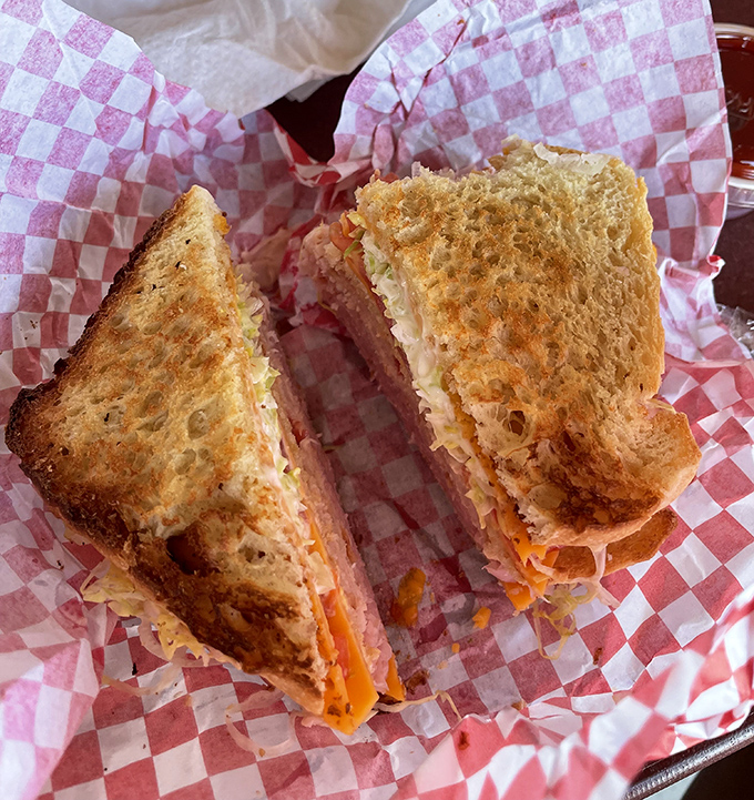 This isn't just a sandwich; it's architecture. Perfectly toasted bread creating that satisfying crunch before revealing layers of savory goodness within.c