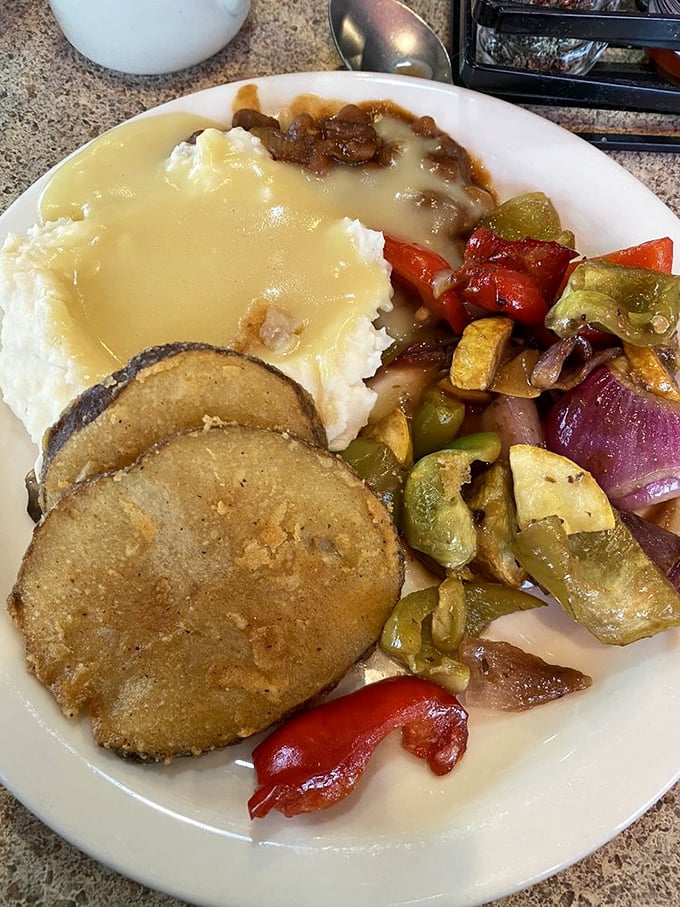 Comfort food that doesn't need a filter. Mashed potatoes, gravy, and saut&eacute;ed vegetables creating the holy trinity of satisfaction on a single plate.