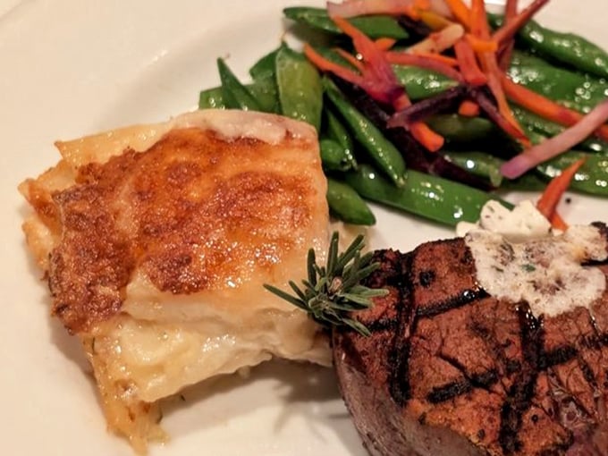 Steak's perfect dance partner: a golden potato gratin that's achieved the ideal balance between crispy top and creamy center.