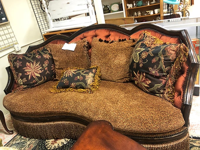Not your average sofa! This leopard-print beauty with ornate wooden trim demands a home where "subtle" isn't in the vocabulary.