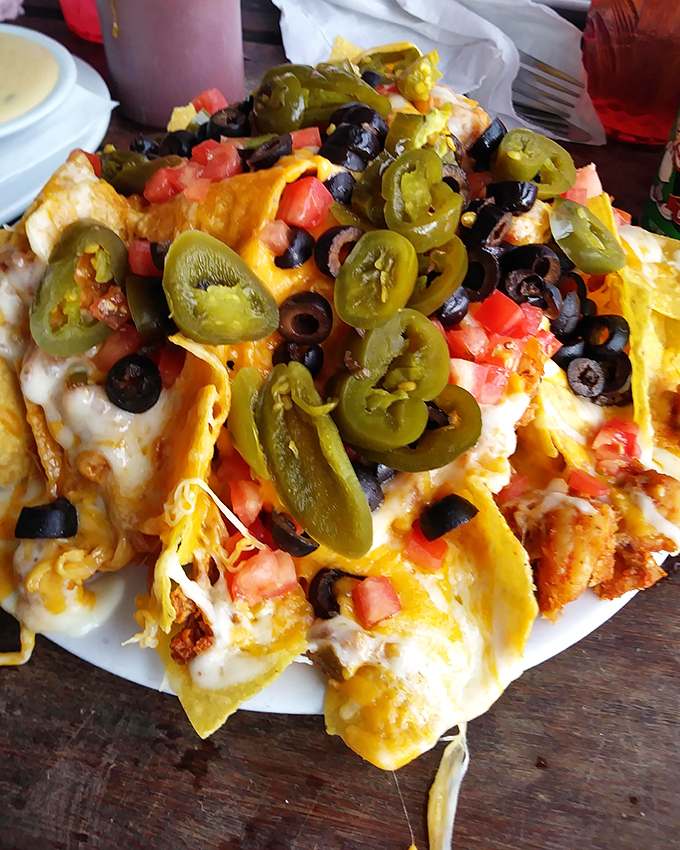 Seafood nachos that would make a Tex-Mex purist weep with joy &ndash; crispy chips buried under an avalanche of Gulf treasures.