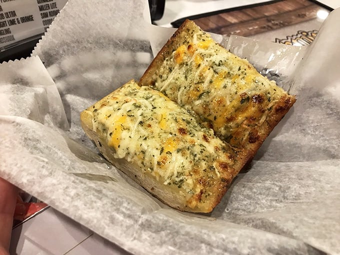 Golden garlic bread that serves as the perfect buttery foundation for soaking up all those magnificent Cajun flavors.