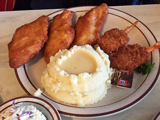 The mashed potatoes form a perfect gravy reservoir, while those golden-fried treasures remind you why simple food done right is unbeatable.