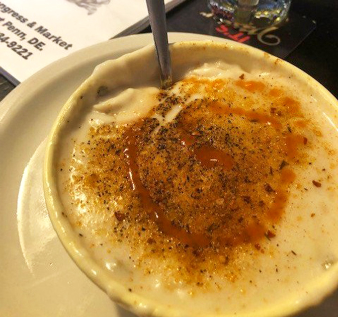 This isn't just soup; it's a creamy, spice-flecked hug in a bowl that makes you understand why people drive for miles.
