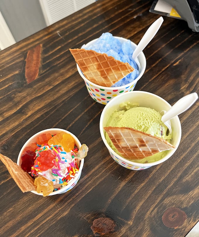 A triple threat of joy! Blue Italian ice, pistachio gelato, and a festive sundae&mdash;proof that decisions were meant to be ignored.