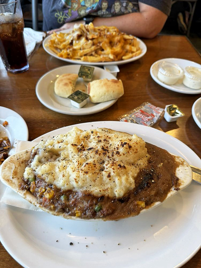 Shepherd's pie reimagined: a hearty stew topped with cloud-like mashed potatoes that have been broiled to golden perfection. Comfort food elevated.