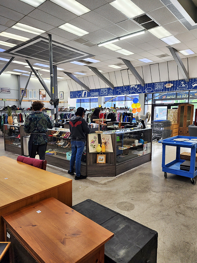 Treasure hunters in their natural habitat, scanning racks with the focused determination of archaeologists on the brink of discovery.