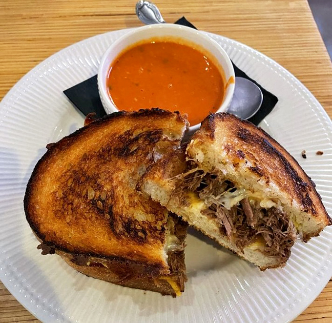 The short rib grilled cheese achieves that perfect balance of crispy exterior and gooey interior, with tender meat that makes resistance futile.