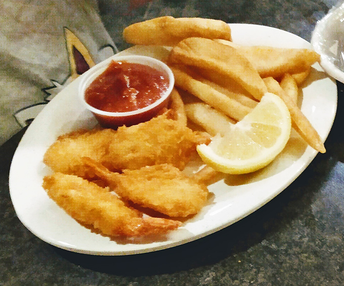 Golden-fried shrimp that snap with each bite, paired with crispy fries and tangy cocktail sauce&mdash;seafood simplicity that never goes out of style.