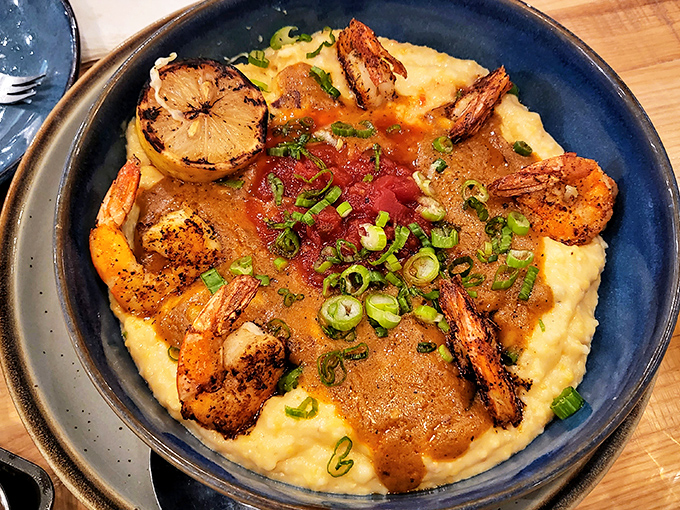 Southern comfort meets coastal luxury in this shrimp and grits masterpiece—creamy grits providing the perfect canvas for perfectly seasoned shrimp and savory sauce.