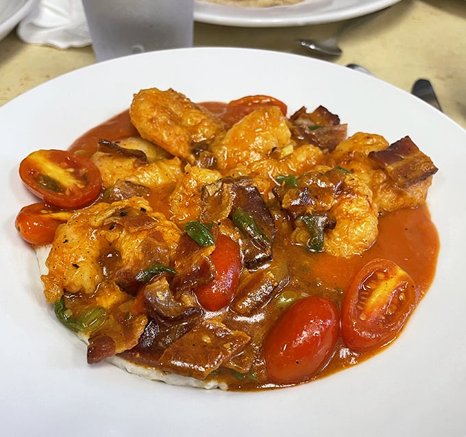 Creamy grits cradle plump shrimp like a warm Southern hug on your breakfast plate.