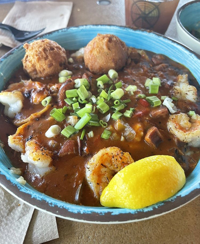 Shrimp and grits that would make a Southern grandmother nod in approval – plump shrimp nestled in a rich, saucy embrace over a bed of comfort.