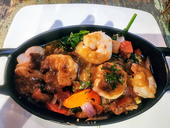 Shrimp and grits elevated to an art form&mdash;plump crustaceans swimming in savory goodness atop a bed of creamy Southern comfort.