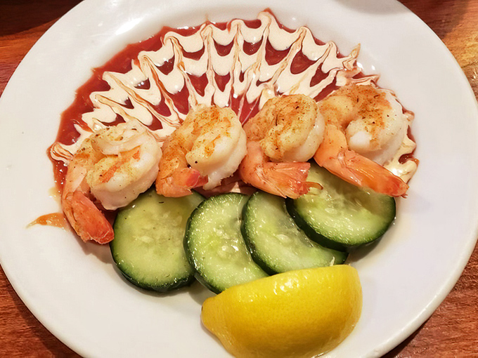 Perfectly cooked shrimp perched on cucumber slices&mdash;a simple presentation that lets quality speak louder than garnishes.