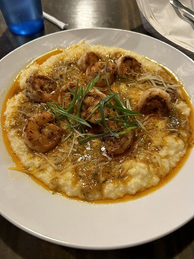 The shrimp and grits that launched a thousand road trips &ndash; plump shrimp nestled on creamy grits with a sauce worth bottling.