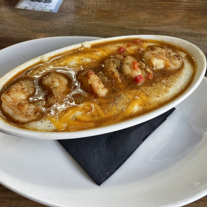 These shrimp and grits aren't just a meal—they're a warm Southern hug in a bowl, complete with a cheese pull that deserves its own Instagram.