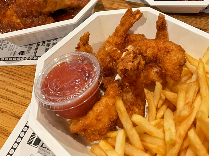 Golden-fried shrimp that crunch like autumn leaves, served with fries and a sauce that makes you wonder why you'd ever eat seafood anywhere else.