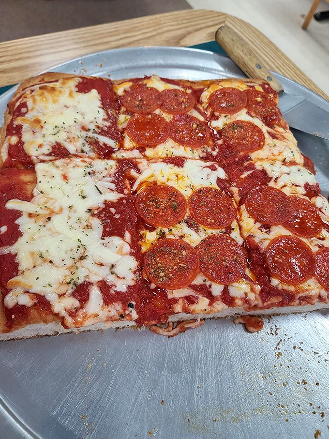 This Sicilian pizza slice proves that sometimes the best things come in perfectly rectangular, cheese-covered packages.