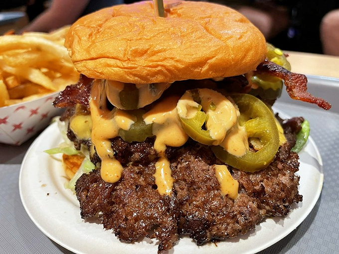 Behold the perfect smash burger in its natural habitat. That crust! Those pickles! That sauce! It's the holy trinity of burger perfection.
