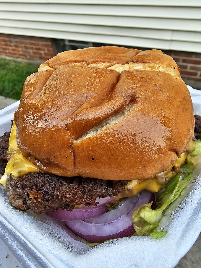 This isn't just a burger&mdash;it's an architectural marvel. The brioche bun struggles heroically to contain a patty that's been smashed into submission and crowned with melty American cheese.
