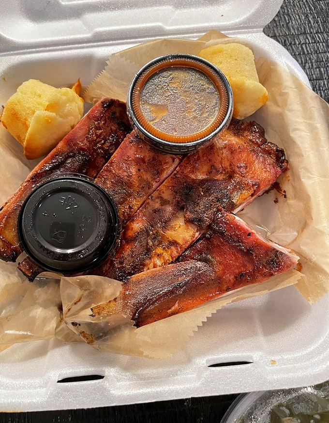 These ribs arrive in a humble takeout container, but don't be fooled—they're dressed in a bark so perfect it deserves its own red carpet.