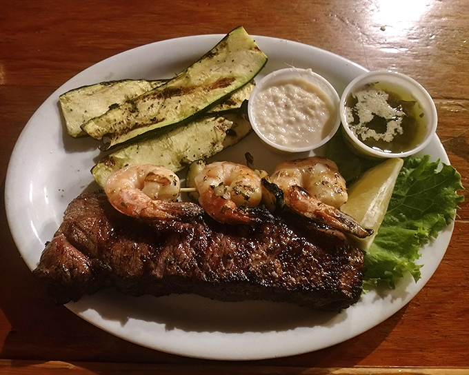 Surf meets turf in this carnivore's dream team. The steak and prawns aren't just sharing a plate&mdash;they're creating a flavor alliance worth crossing county lines for.