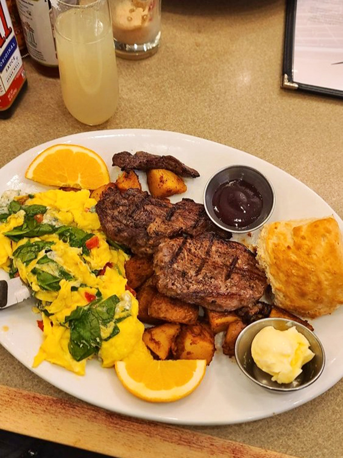 This isn't just breakfast, it's a morning masterpiece. Vibrant eggs, seasoned potatoes, and steak that makes waking up early completely worth it.