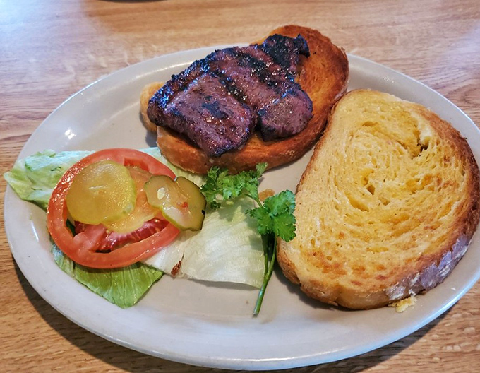The steak sandwich doesn't mess around&mdash;just quality beef on golden cheese toast with fresh veggies. No foodie hashtags needed, just satisfaction guaranteed.