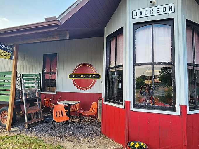 The Jackson depot stands as a cheerful sentinel of railroad history, its red and white fa&ccedil;ade a beacon to train enthusiasts and the merely curious alike.