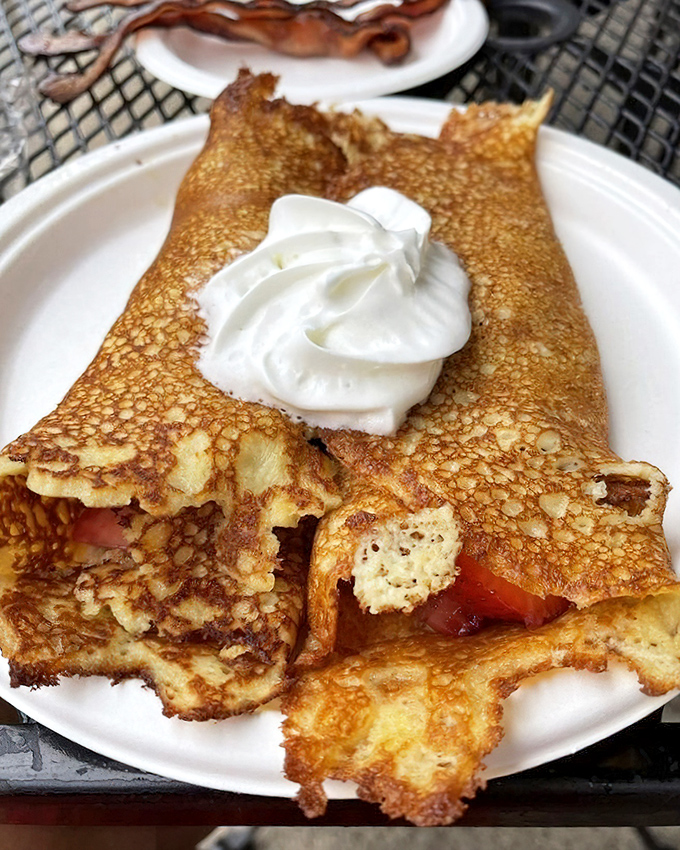 These aren't just pancakes; they're Pamela's legendary hotcakes with crispy edges that extend beyond the plate like delicious solar flares.