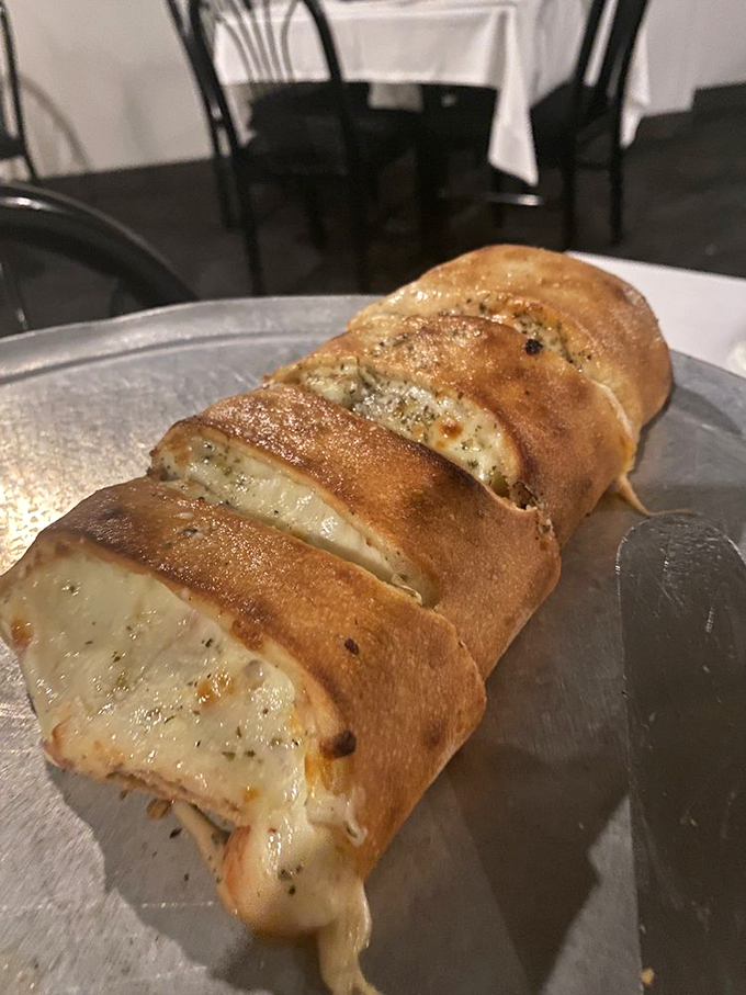 This stromboli isn't just food&mdash;it's architecture. Layers of bread, cheese, and seasonings creating the Taj Mahal of handheld Italian delights.