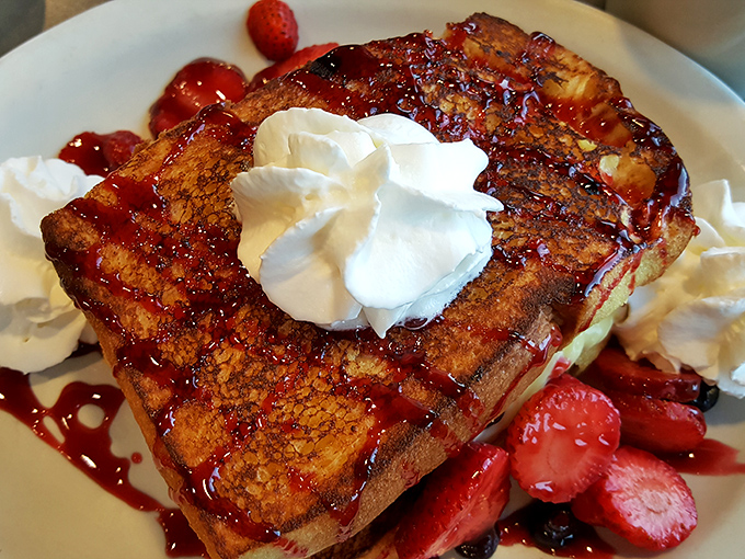 This isn't just French toast&mdash;it's a breakfast masterpiece. Thick-cut bread transformed into a berry-topped, whipped cream-crowned morning indulgence that would make Paris jealous.