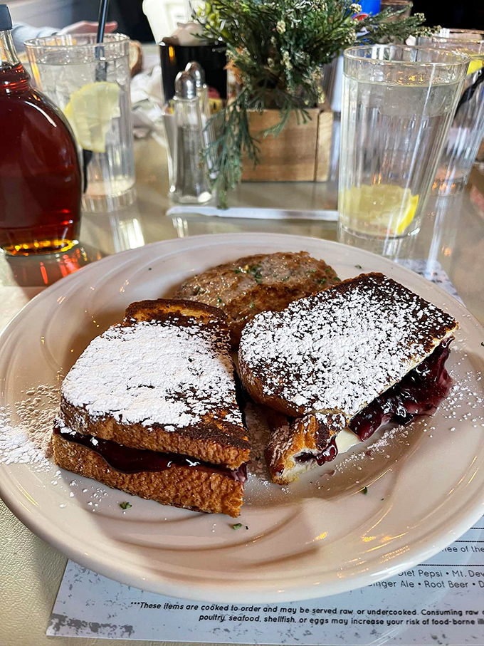 This isn't just French toast &ndash; it's French toast that went to Paris, fell in love, and came back transformed. The powdered sugar snowfall is just showing off.