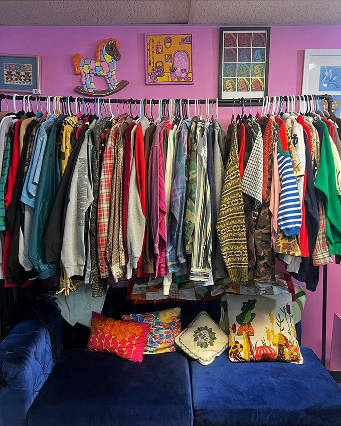 The wall of wearable nostalgia against that perfect pink backdrop. Even the rocking horse seems to approve of these vintage finds.