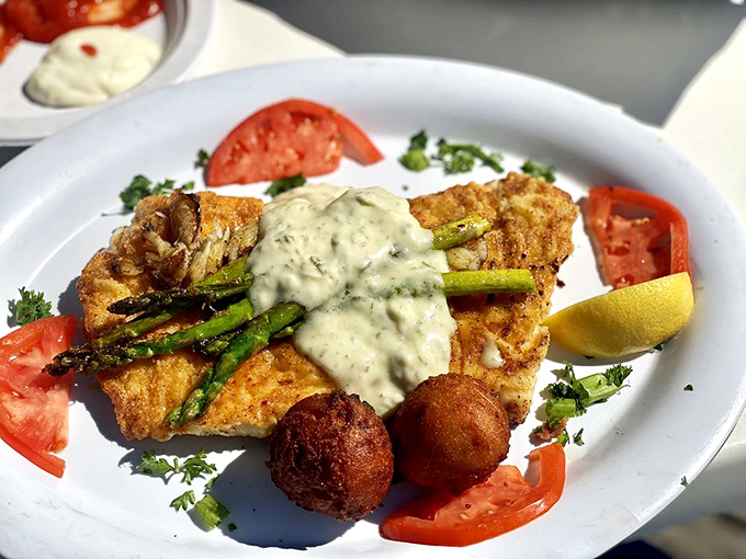 The Imperial showcases Gulf seafood at its finest, crowned with asparagus and creamy sauce dreams.