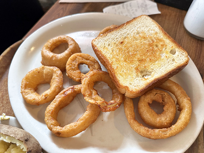 Golden onion rings and buttery toast&mdash;the supporting actors that deserve their own standing ovation in the meat-centric drama of your meal.