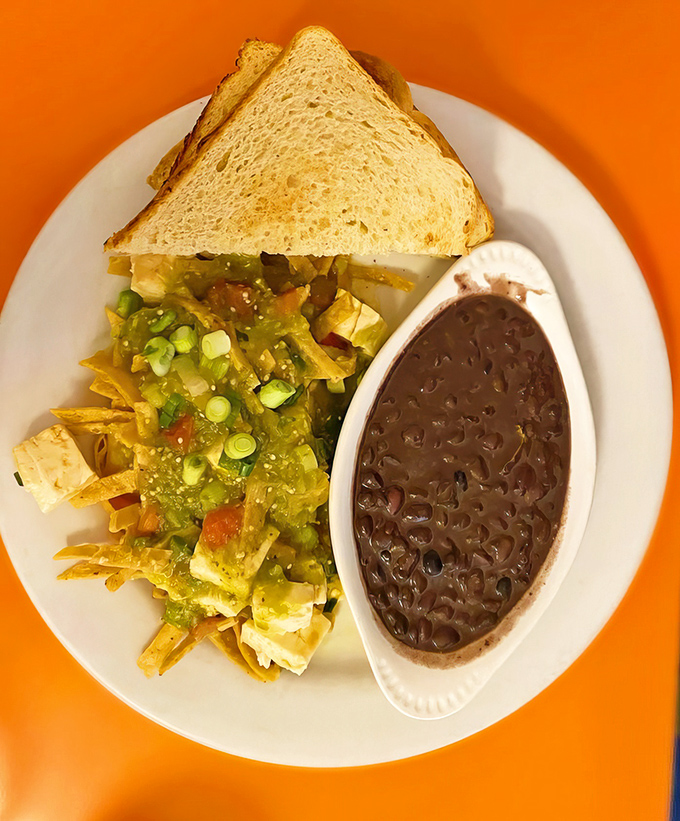 Who needs meat when you've got tofu chilaquiles this good? Black beans and crispy tortilla chips make this a fiesta on a plate.